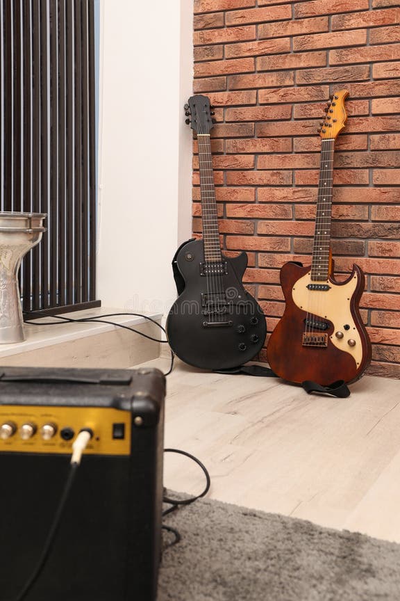 Modern Electric Guitars and Amplifier in Studio Stock Image - Image of ...