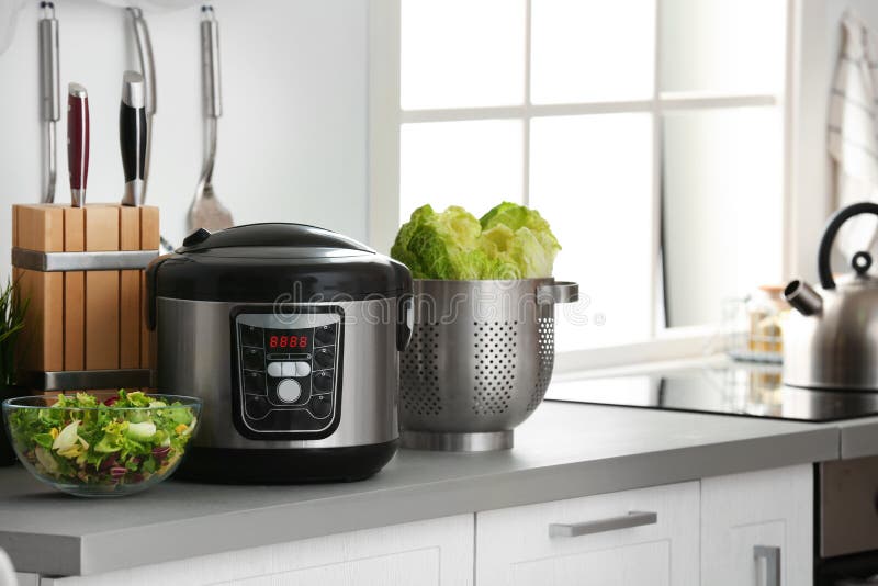 Modern Electric Multi Cooker and Food on Kitchen Countertop. Stock ...