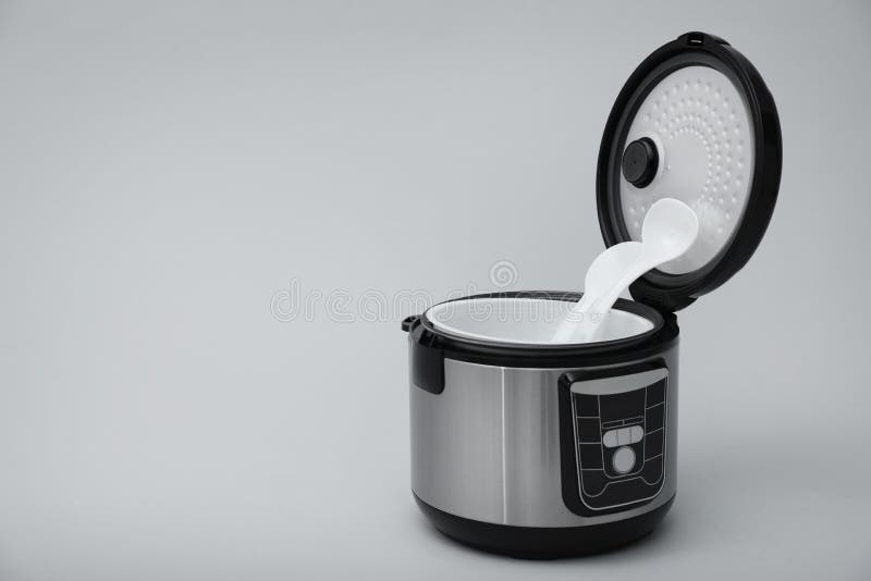 Modern Electric Multi Cooker, Parts and Accessories on Grey Background ...