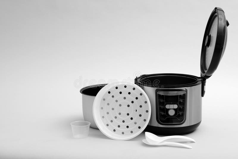 Modern Electric Multi Cooker, Parts and Accessories on Grey Background ...