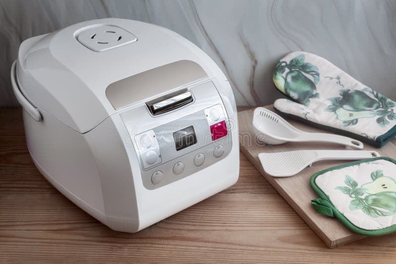 Modern Electric Multi-cooker and a Set of Kitchen Accessories Stock ...