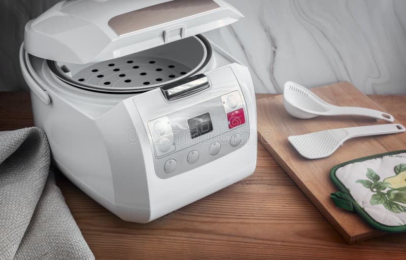Modern Electric Multi-cooker and a Set of Kitchen Accessories Stock ...