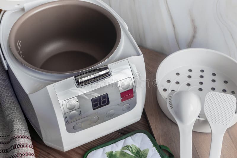 Modern Electric Multi-cooker and a Set of Kitchen Accessories Stock ...