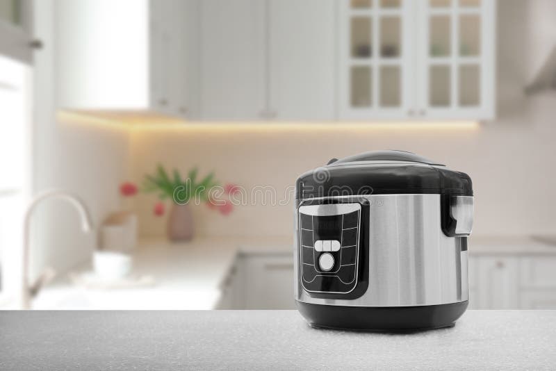 Electric Multi Cooker on Table in Kitchen. Space for Design Stock Image ...