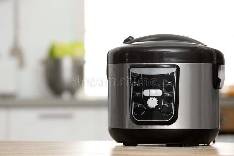 Modern Electric Multi Cooker on Table in Kitchen. Stock Image - Image ...