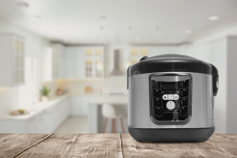 Modern Electric Multi Cooker on Table in Kitchen. Space for Design ...