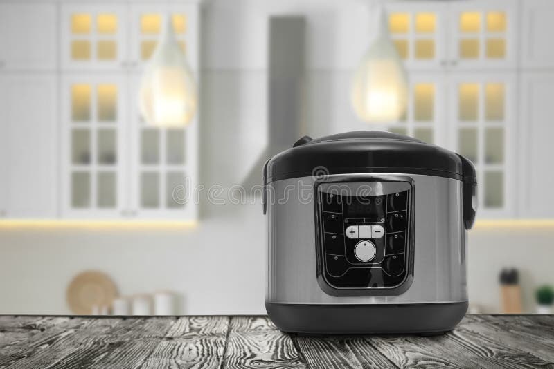 Modern Electric Multi Cooker on Table in Kitchen. Space for Design ...