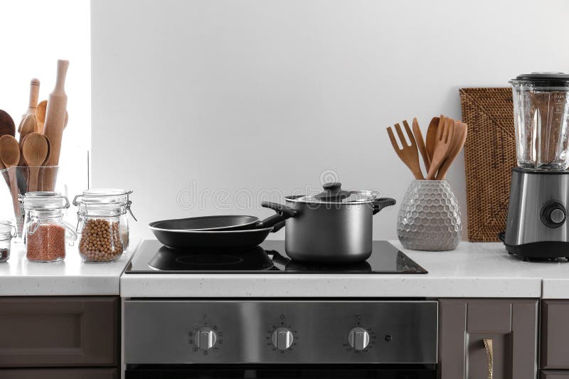 Modern Electric Stove and Utensils in Kitchen Stock Image - Image of ...
