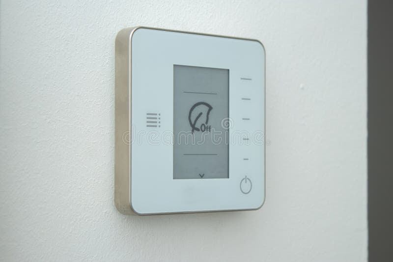 A Modern Electric Thermostat Control System on White Wall Stock Photo ...