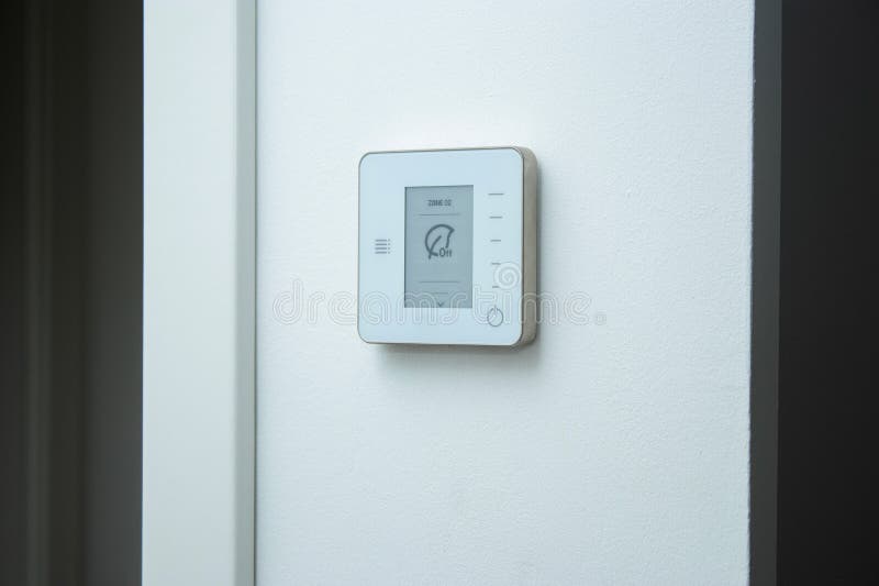 A Modern Electric Thermostat Control System on White Wall Stock Photo ...