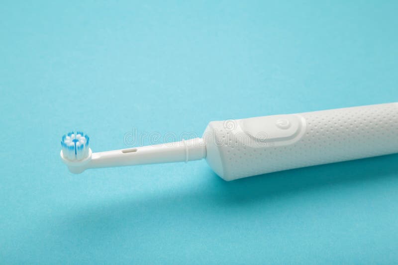Modern Electric Toothbrush on Blue Background. Controlled Tool for ...