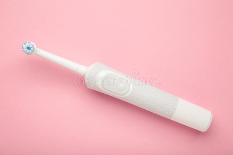 Modern Electric Toothbrush on Pink Background. Controlled Tool for ...
