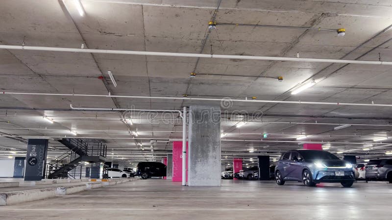 A Modern Electric Vehicle are Parking Inside a Spacious Contemporary ...