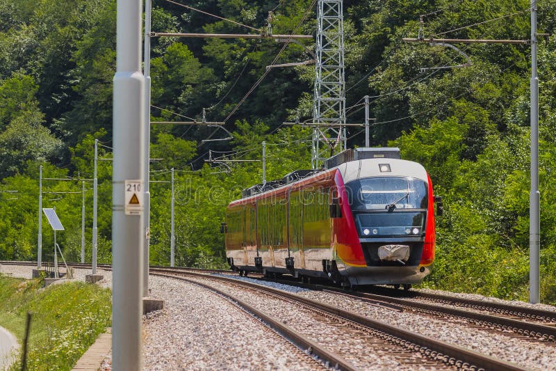 Modern Electrical Multiple Unit Train on an Open Track. Commuter Train ...