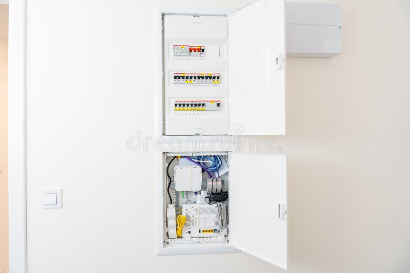Modern Electrical and Network Distribution Panel with Open Doors in a ...