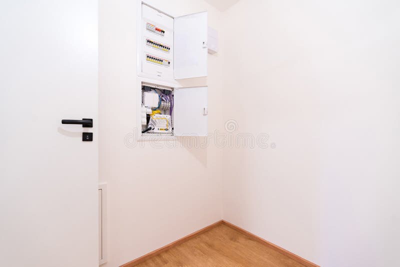 Modern Electrical and Network Distribution Panel with Open Doors in a ...