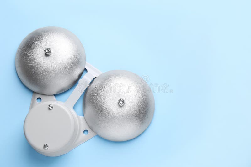 Modern Electrical School Bell on Light Blue Background, Top View. Space ...