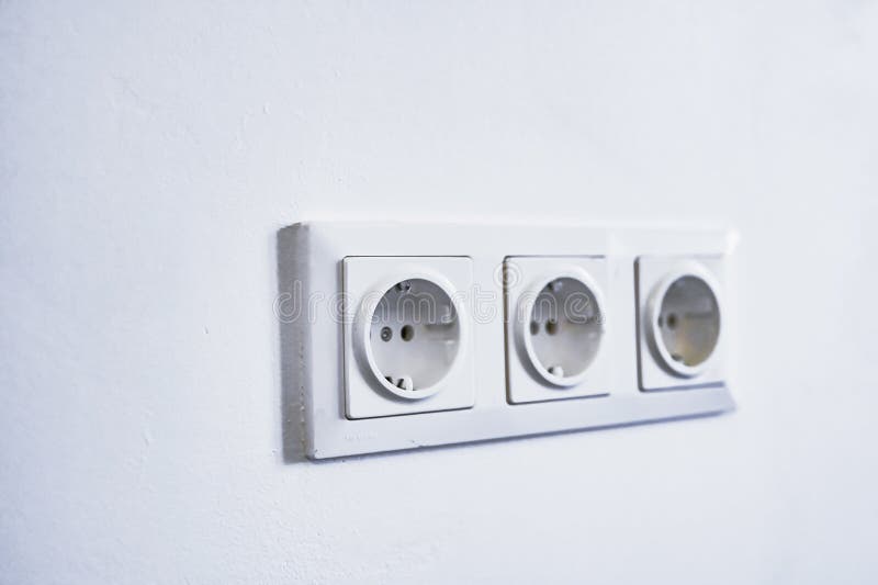 Close-up of Two Triple Wires for Electrical Outlets on a Bare Wall ...