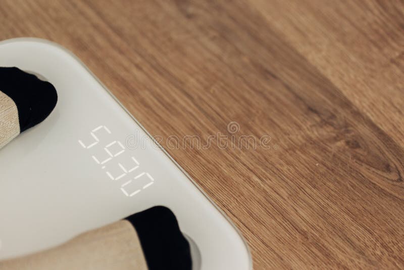 Girl Measures Weight on Smart Scales. Modern Electronic Device. Stock ...