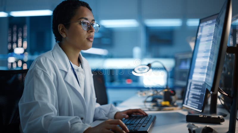 Modern Electronics Development Facility: Female Engineer Works on ...