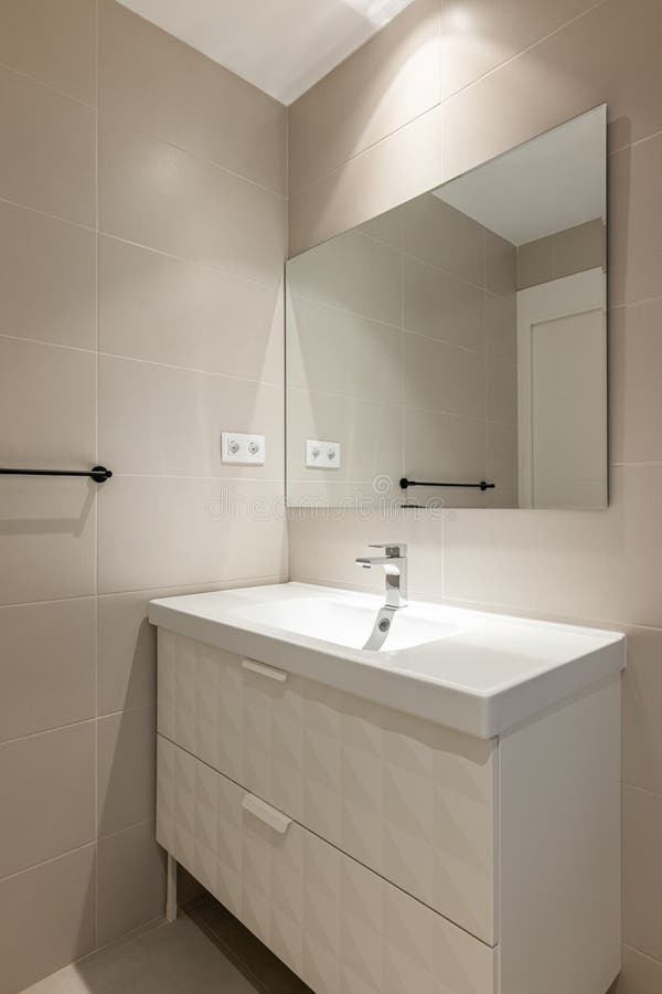 Modern Empty Bathroom with Beige Tiles, Furniture and Rectangular ...
