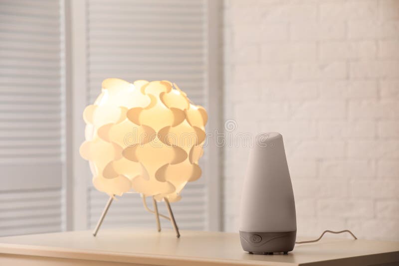 Modern Essential Oil Diffuser on Table Stock Photo - Image of aroma ...