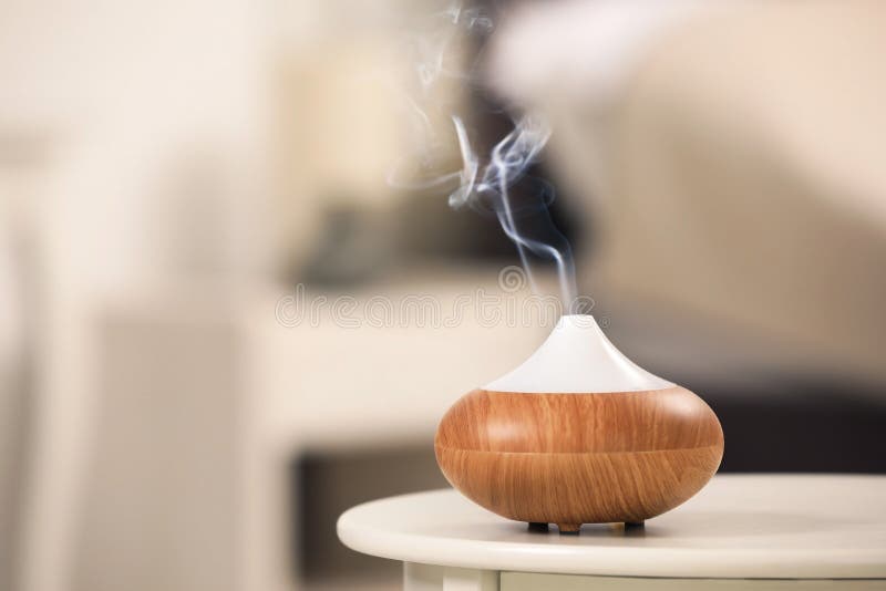 Modern Essential Oil Diffuser on Table Indoors Stock Image - Image of ...