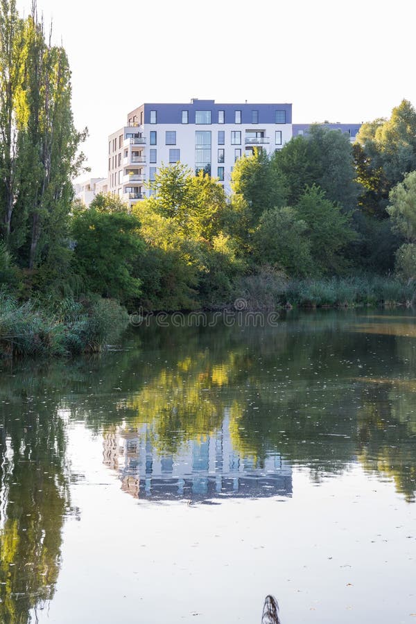 Modern European Architecture Small Pond Park Sunset Stock Image - Image ...