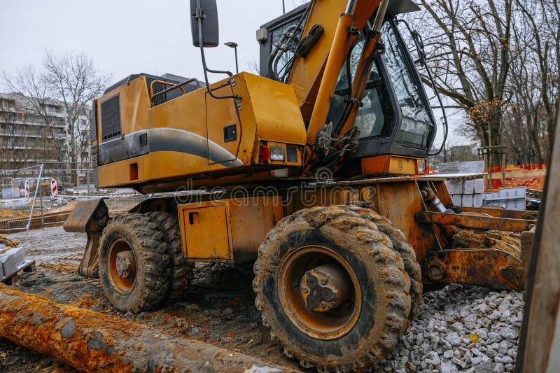 Modern Excavator with a Blade and Pipe at a Construction Site on an ...