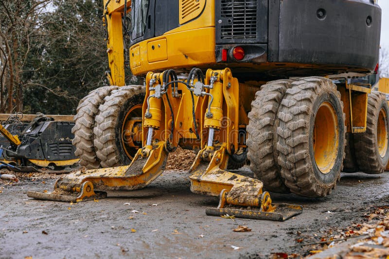Modern Excavator with a Blade and Pipe at a Construction Site on an ...