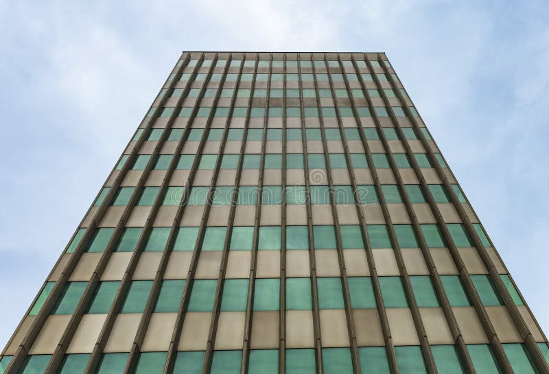 Facade with Green Vertical Garden and Red Windows in a Sustainable ...