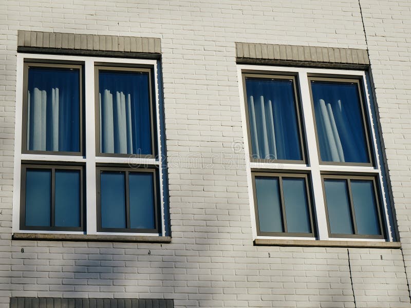 Modern Facade with Large Windows and White Brick Exterior Stock Image ...