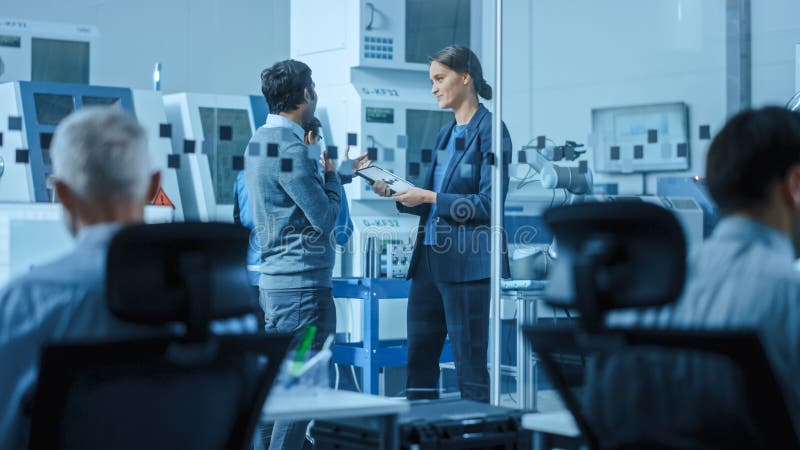 Modern Factory: Female Project Manager Male Engineer Standing in High ...