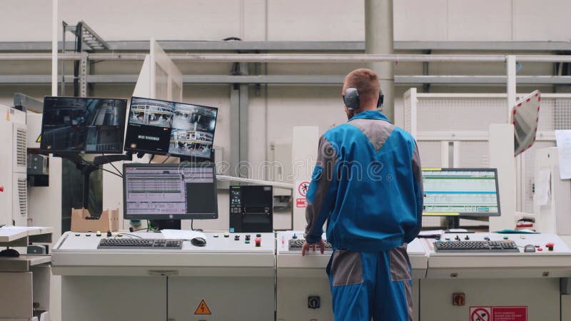 Modern Factory: a Male Operator Manages the Production Line of an ...