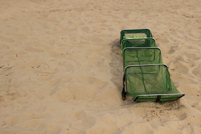 Modern Fishing Net Dries Out on the Sand. Routine after Having an ...