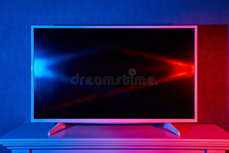 A Flat TV Lit with Red and Blue Colors Stock Image - Image of ...