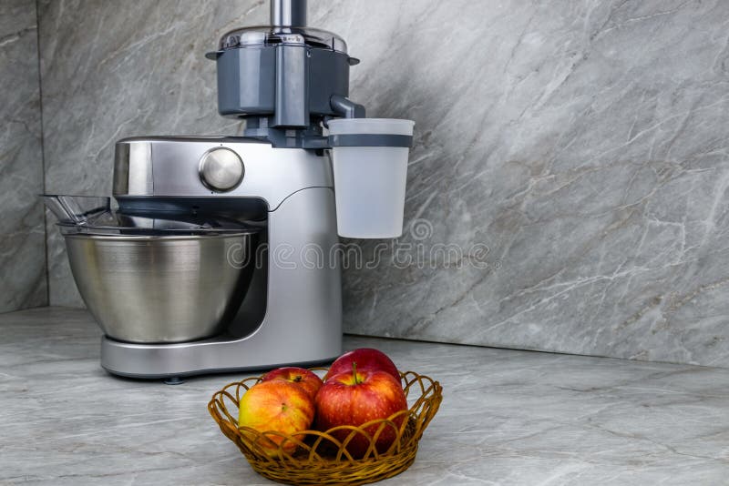 Modern Food Processor with Juicer and Plate with Apples on a Kitchen ...