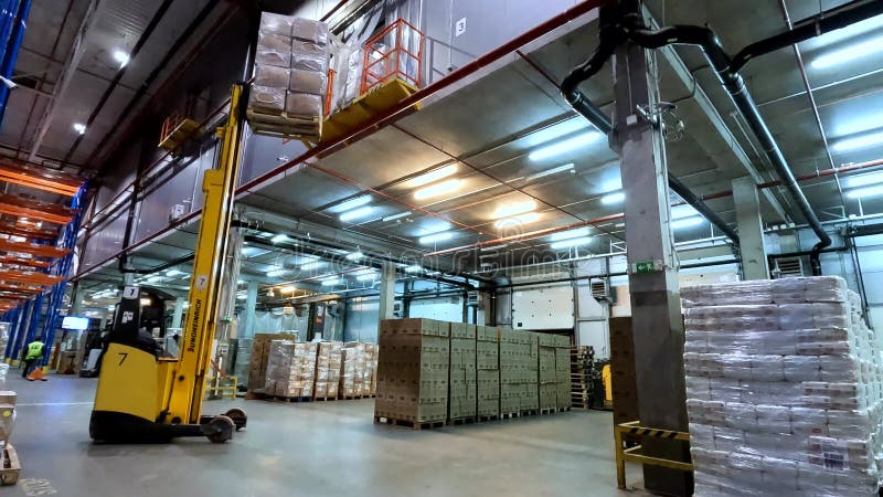 Forklift with Cargo in the Warehouse. Modern Forklift in a Large ...
