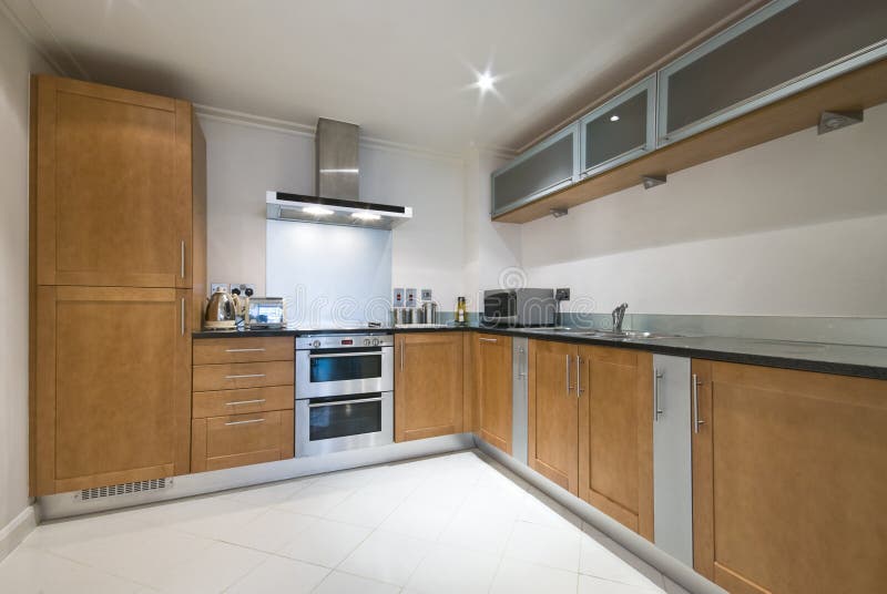 Fully Fitted Contemporary Kitchen in White Stock Image - Image of food ...