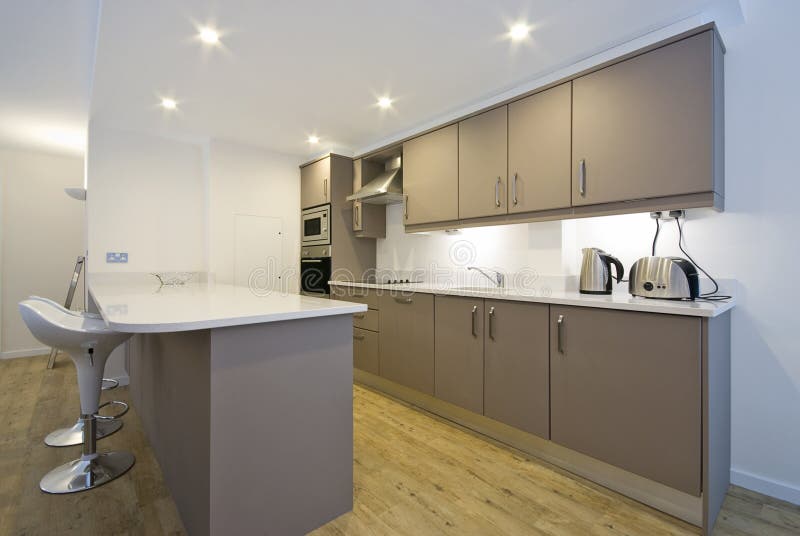 Fully Fitted Contemporary Kitchen in White Stock Image - Image of food ...