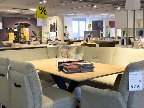 Modern Furniture Store Interior with Stylish Sofas and Dining Table ...