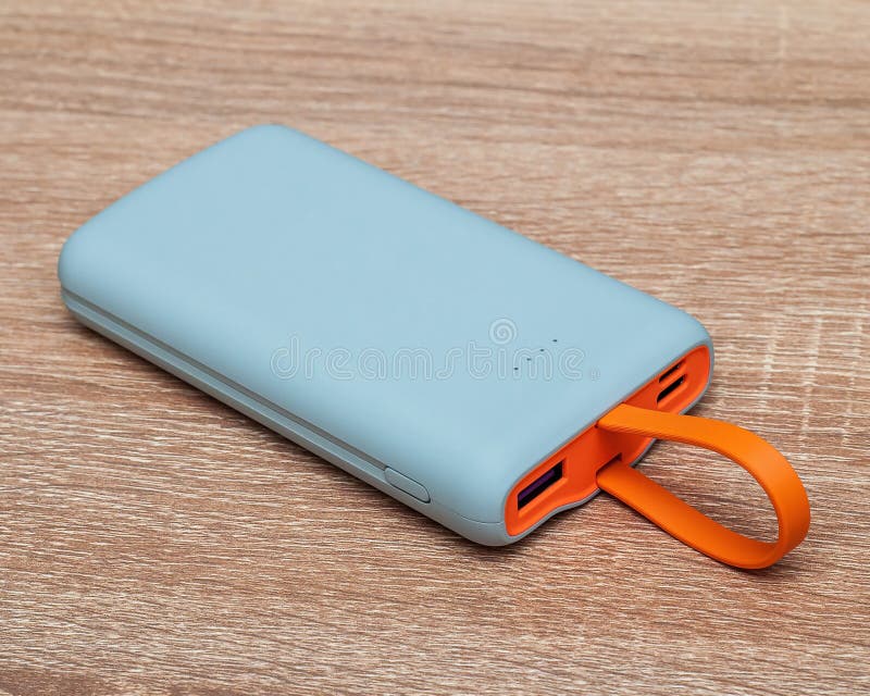 A Modern Gadget for Charging Devices, a Power Bank with an Orange USB ...