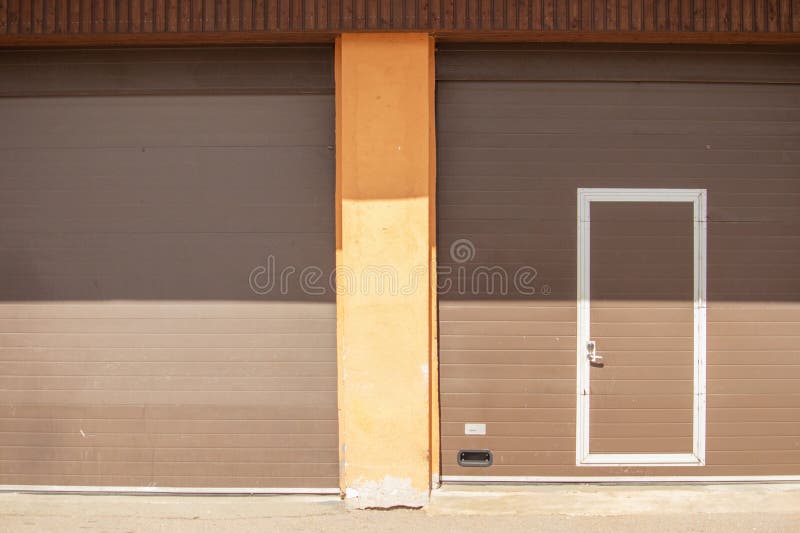 A Modern Garaga Gates with a Door Stock Photo - Image of ground, brick ...