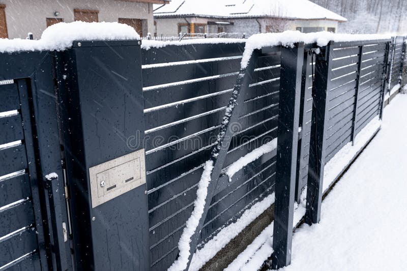 A Modern Gate with a Letterbox and a Wireless Card Reader, Mounted in ...