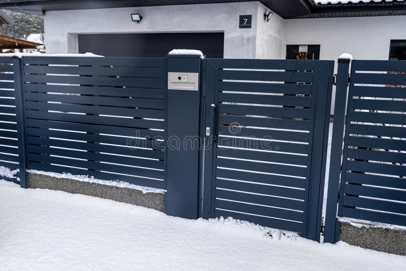 A Modern Gate with a Letterbox and a Wireless Card Reader, Mounted in ...