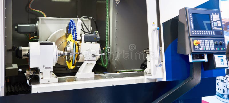 Gear Grinding Machine in Operation, Grinding of Teeth of a Wheel with ...