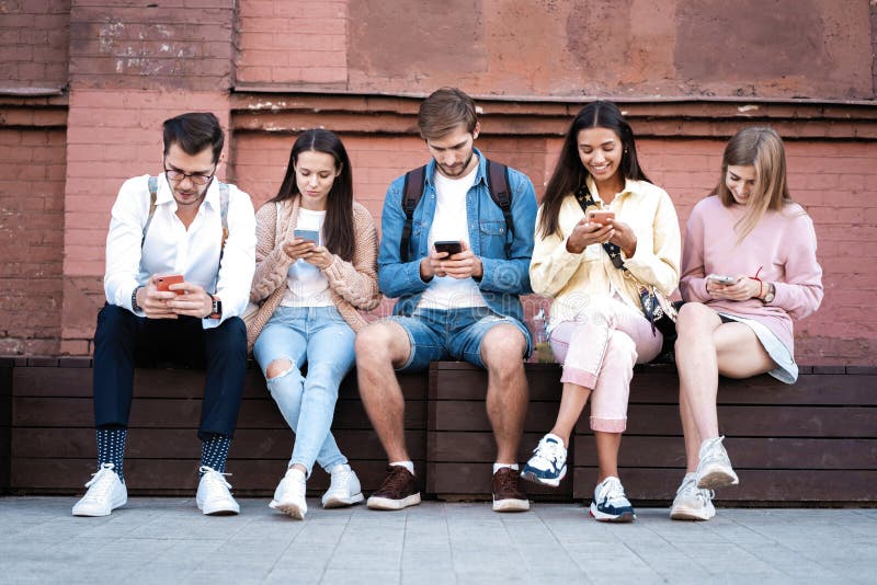 Modern Generation. Group of People Using Gadgets, Sitting on Stairs ...