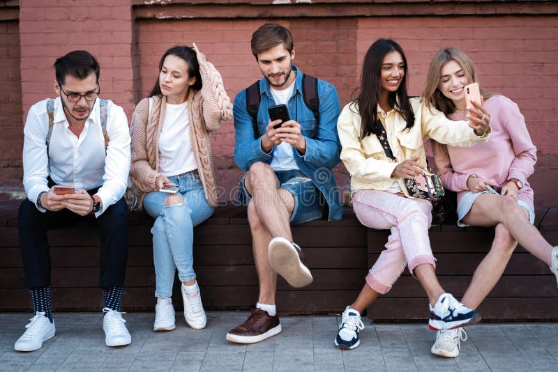 Modern Generation. Group of People Using Gadgets, Sitting on Stairs ...