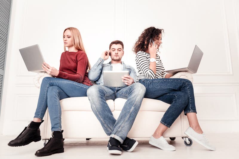 Smart Young People Using Their Laptops Stock Image - Image of college ...