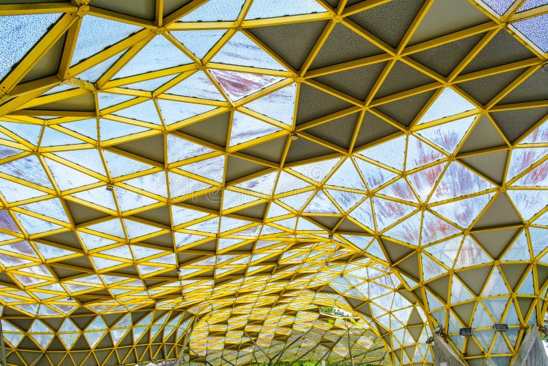 Modern Geometric Yellow Lattice Roof Structure with a Repetitive ...